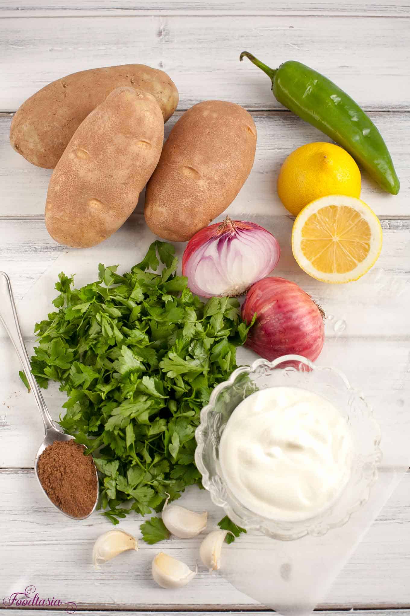 Middle Eastern Kufta Baked with Potatoes and Tahini Sauce | Foodtasia